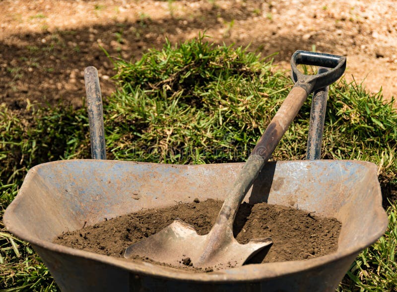 Wheelbarrow with Soil, Shovel and Grass Stock Image - Image of carry ...