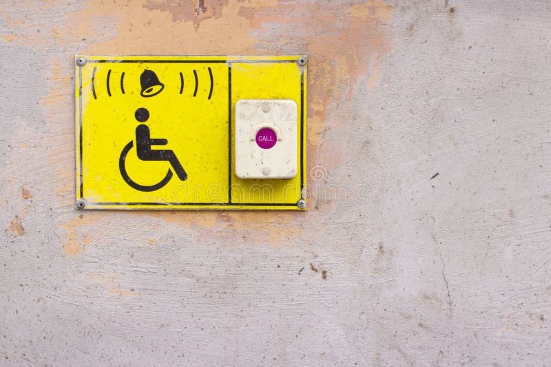 Wheelchair Assistance Call Button on an Old Painted Wall. Stock Photo ...