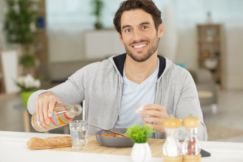 Wheelchair Bound Man Eating Meal Alone at Home Stock Photo - Image of ...