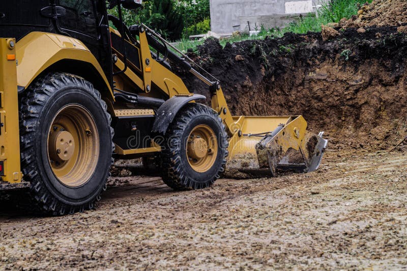 Wheeled Loader Excavator with Backhoe for Earthmoving Works Stock Image ...