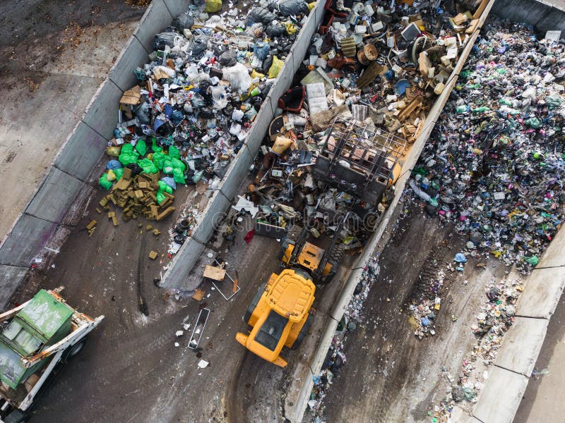 Wheeled Loader Loading a Bucket with Garbage at a Landfill Stock Image ...