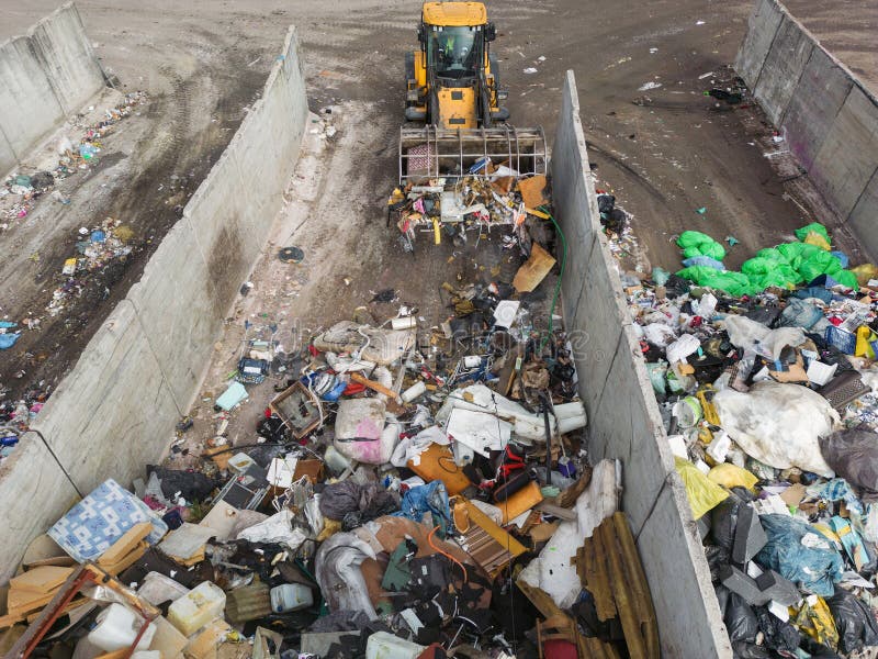 Moving a Pile of Waste with a Wheel Loader at the Landfill, Aerial View ...