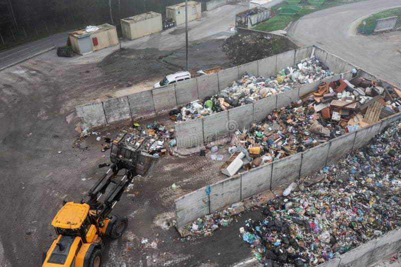 Moving a Pile of Waste with a Wheel Loader at the Landfill, Aerial View ...