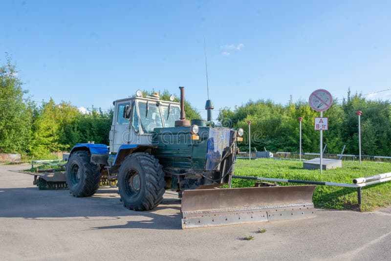 Wheeled Tractor Bulldozer with a Blade. Editorial Photography - Image ...