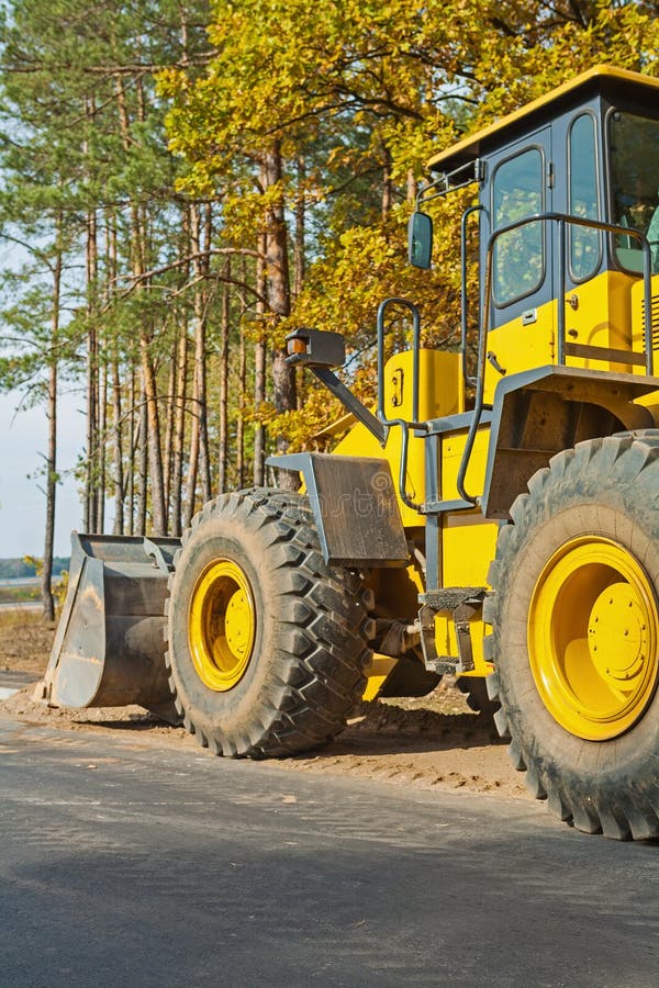 Wheelloader in Forest Near Edge of Road Rear View Stock Image - Image ...