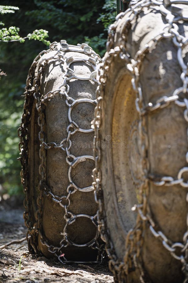 Wheels with mud chains stock image. Image of grip, machine - 346945929