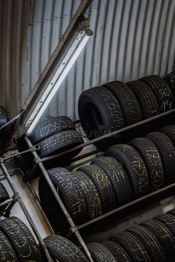 Wheels stacked in a Garage stock image. Image of black - 91310831