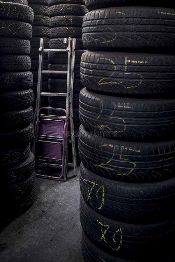 Wheels stacked in a Garage stock photo. Image of garage - 91310846