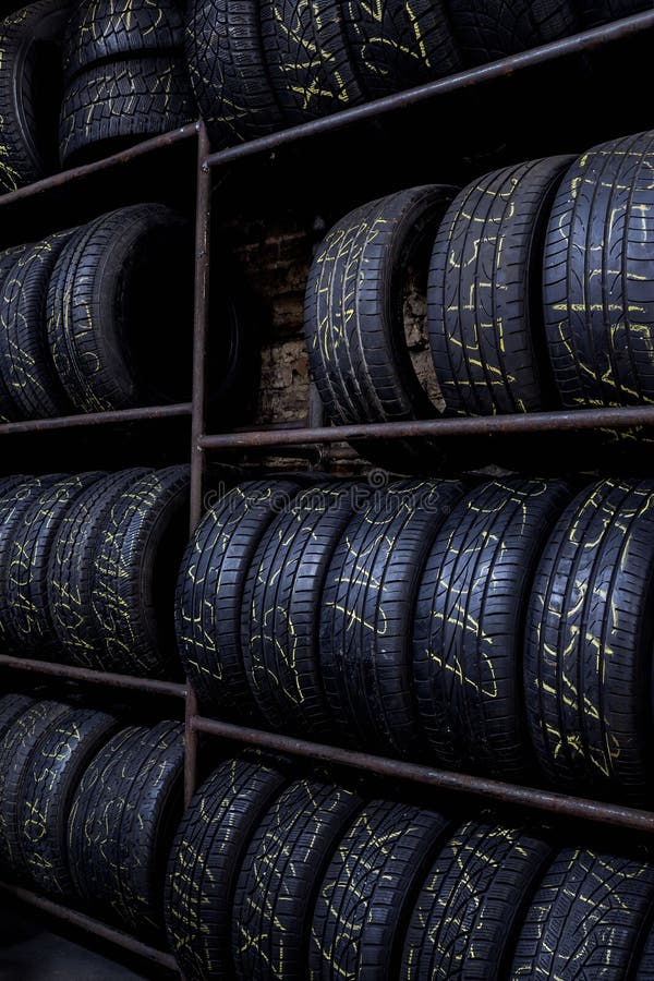 Wheels stacked in a Garage stock image. Image of black - 91310883