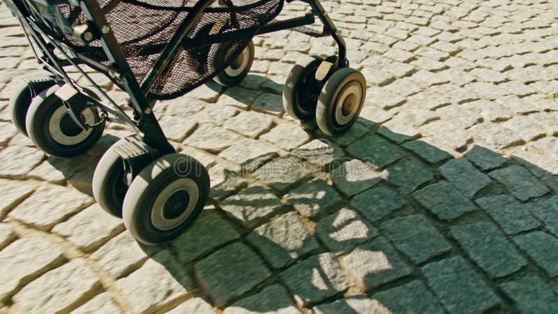 Wheels of a Stroller Rolling on Cobble Stone Road Stock Photo - Image ...
