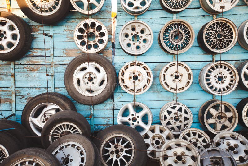 Wheels and Tires on the Wall in the Car Dealership. Stock Photo - Image ...