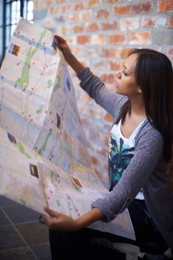 Where Should I Go Next.... a Young Woman Reading a Map. Stock Image ...