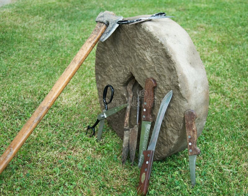 An Old Whetstone for Sharpening Knives. Grinding Wheel on an Old Stock ...