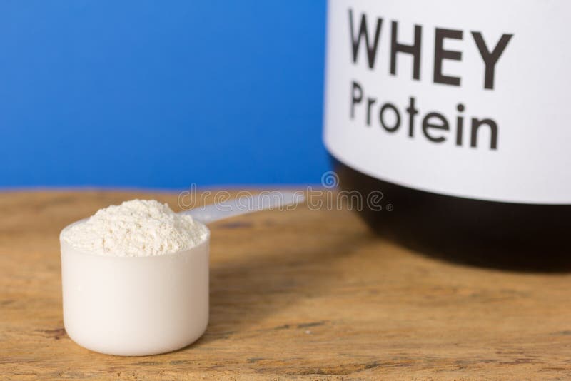 Whey Protein. Front View of Scoop with Vanilla Powder and Jar on Stock ...