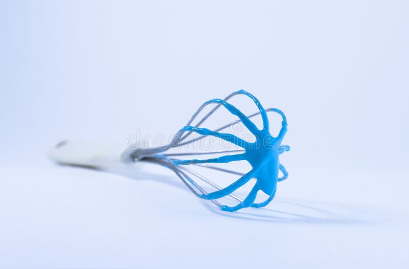 Whisk with blue icing stock photo. Image of beater, cook - 12931142