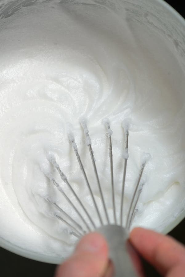 Whisk in whipped cream stock image. Image of kitchenware - 132935853