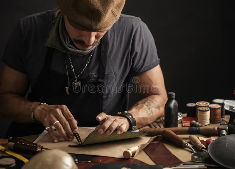 Whiskered Shoemaker with Making Measurments in Patterns at Table in ...
