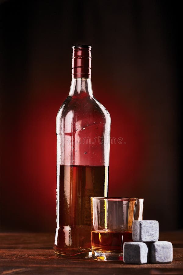 Whiskey Bottle, Stones for Whiskey and Glass, Red Background Stock ...