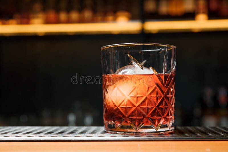Whiskey with an Ice Ball in a Glass Stock Image - Image of liquid ...