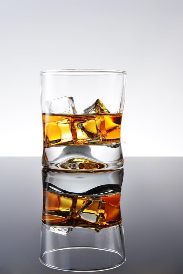 Whisky and ice cube stock image. Image of liquor, golden - 5099901