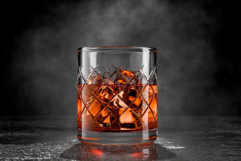 Whiskey with Ice on a Stone Table. Glass of Whiskey with Ice on a ...