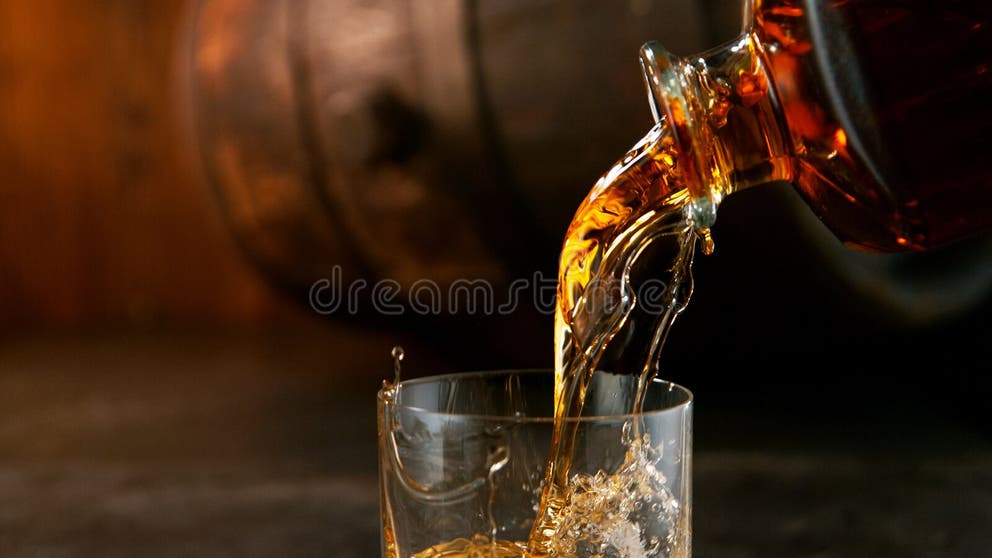 Whiskey Liquid Falling into Glass Stock Photo - Image of drink, camera ...