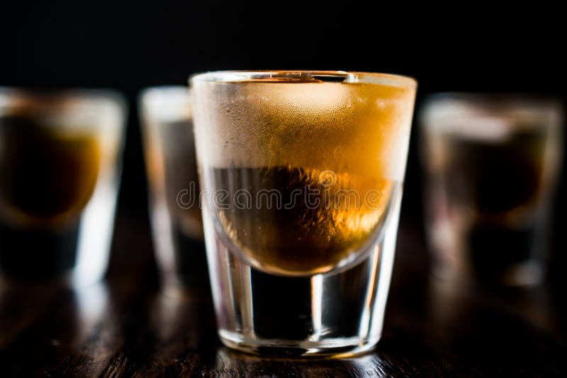 Whiskey Shots with Ice on Dark Wooden Surface. Stock Photo - Image of ...