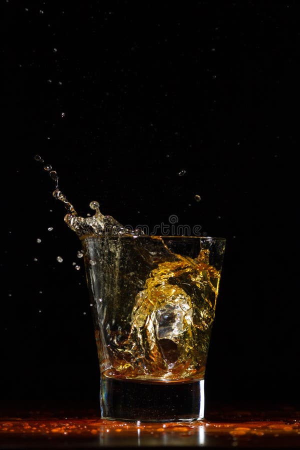 Whiskey Splash in Glass on Black Stock Photo - Image of blower, relax ...