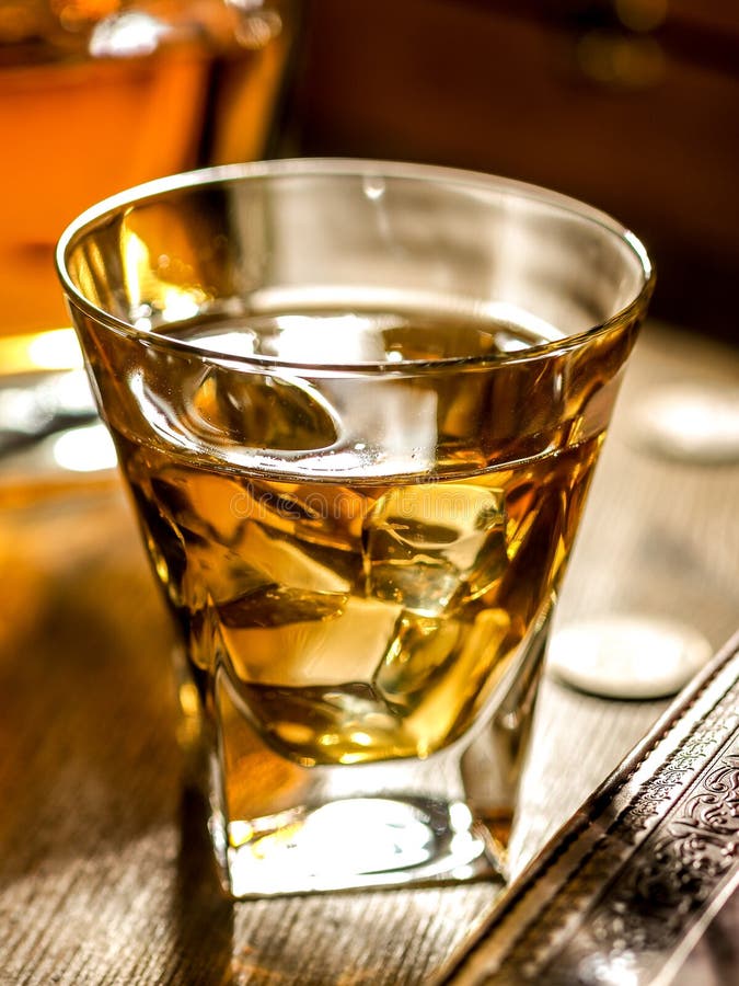 Whisky on the rocks stock photo. Image of golden, bottle - 183043762