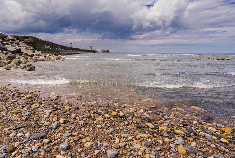 Whitby Rocks and Pebbles stock image. Image of rocks - 334284653