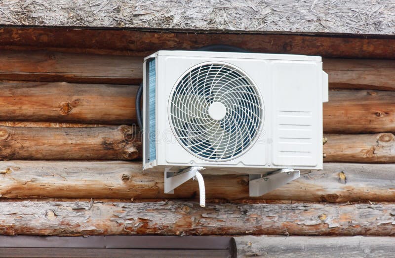 A White Air Conditioner is Mounted on a Wooden Wall Stock Photo - Image ...