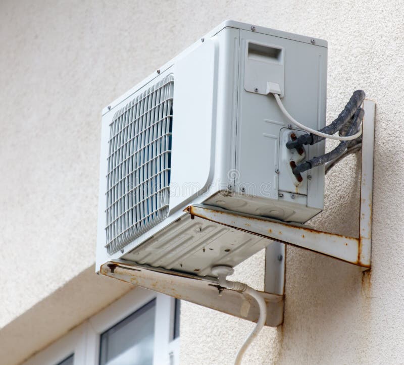 A White Air Conditioner Unit is Mounted on a Wall Stock Image - Image ...