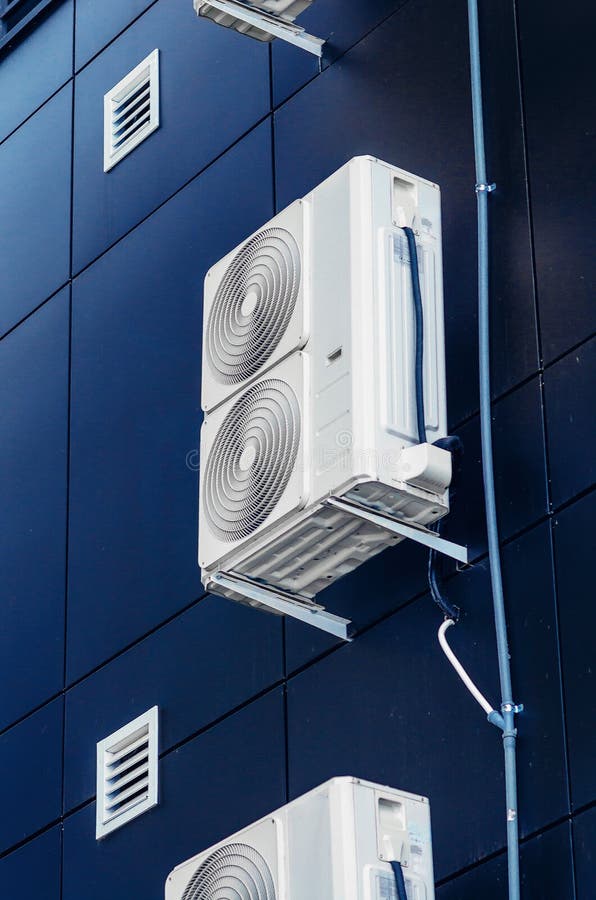 White Air Conditioner on Wall of Modern Building. Ventilation of ...