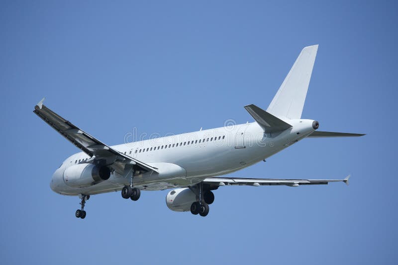White Airplane landing stock photo. Image of white, airbus - 64163068