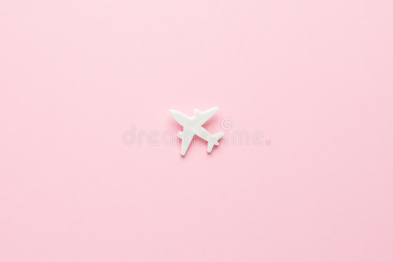 White Airplane Symbol in a Minimal Style on a Pink Background Stock ...