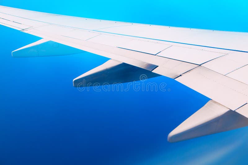 White airplane wing stock image. Image of journey, engine - 202829625