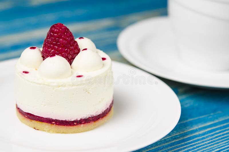 White Airy Cake with Raspberry Layer and Raspberry Berry Lies on a ...