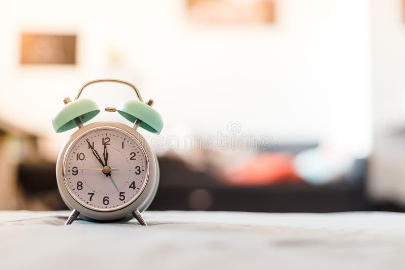 White Alarm Clock on the Bed, Morning, Copyspace Stock Photo - Image of ...