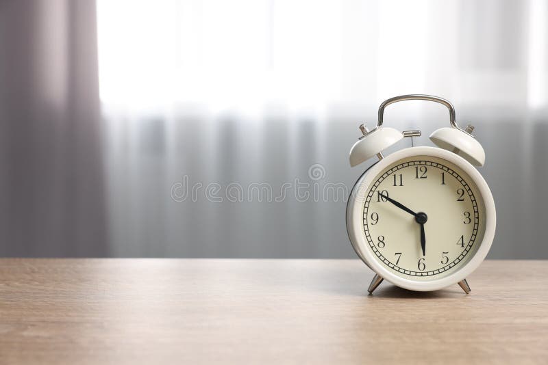 White Alarm Clock on Wooden Table Indoors, Space for Text Stock Photo ...
