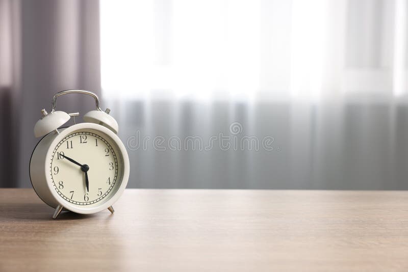 White Alarm Clock on Wooden Table Indoors, Space for Text Stock Photo ...