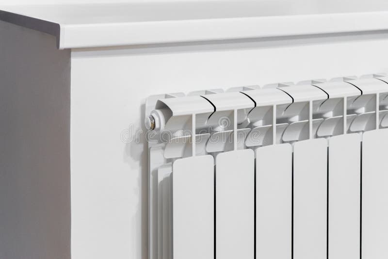 White Aluminum Radiator on Wall Under Plastic Windowsill. Modern Design ...