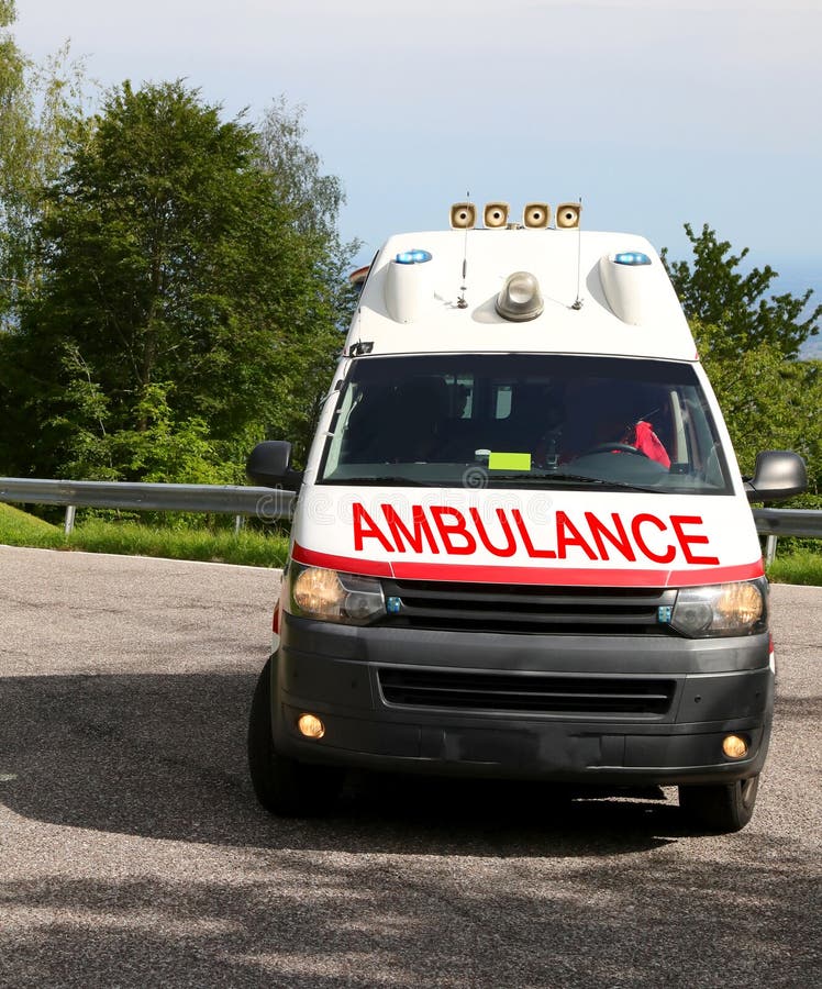White Ambulance Van with Text Speeding Fast with Blue Lights Flashing ...