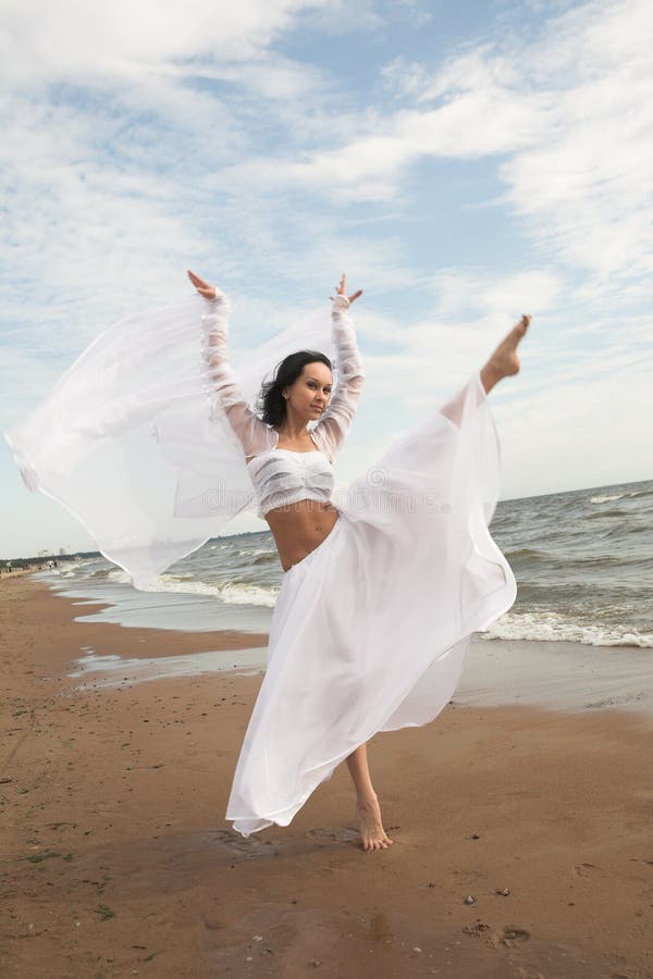 White angel on the beach stock image. Image of adult - 10899063