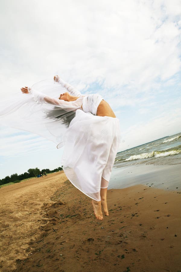White angel on the beach stock image. Image of blue, innocence - 11071511