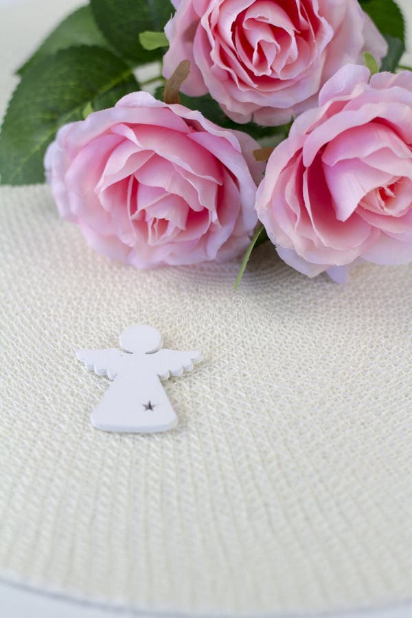 White Angel. Beautiful Pink Flowers on White Desk. Stock Image - Image ...