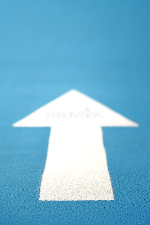 White Arrow on Blue Running Track with Soft Focus Stock Image - Image ...