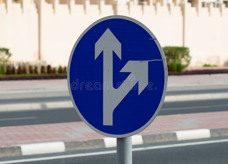 White Arrow on Blue Traffic Sign on the Road To Guide Traffic Stock ...