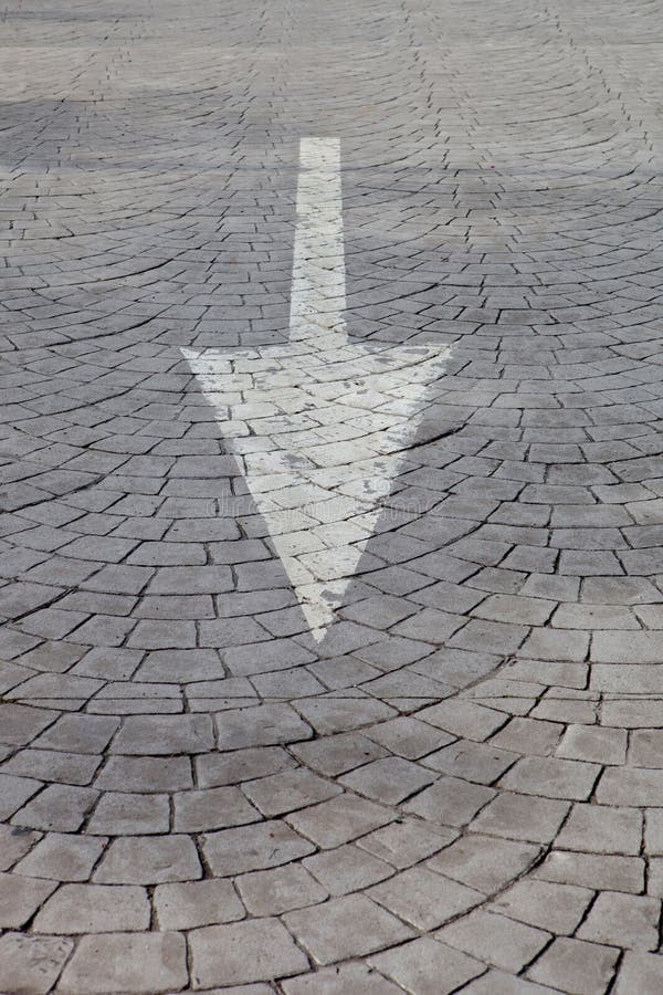 White arrow on a grey road stock image. Image of forward - 62028095