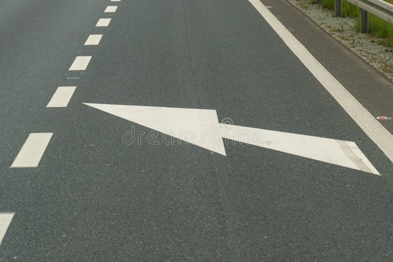 The White Arrow on the Pavement Points To the Left, the Road Narrows ...