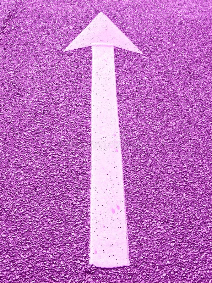 A White Arrow on a Pink Surface Pointing the Way Forward Stock Photo ...